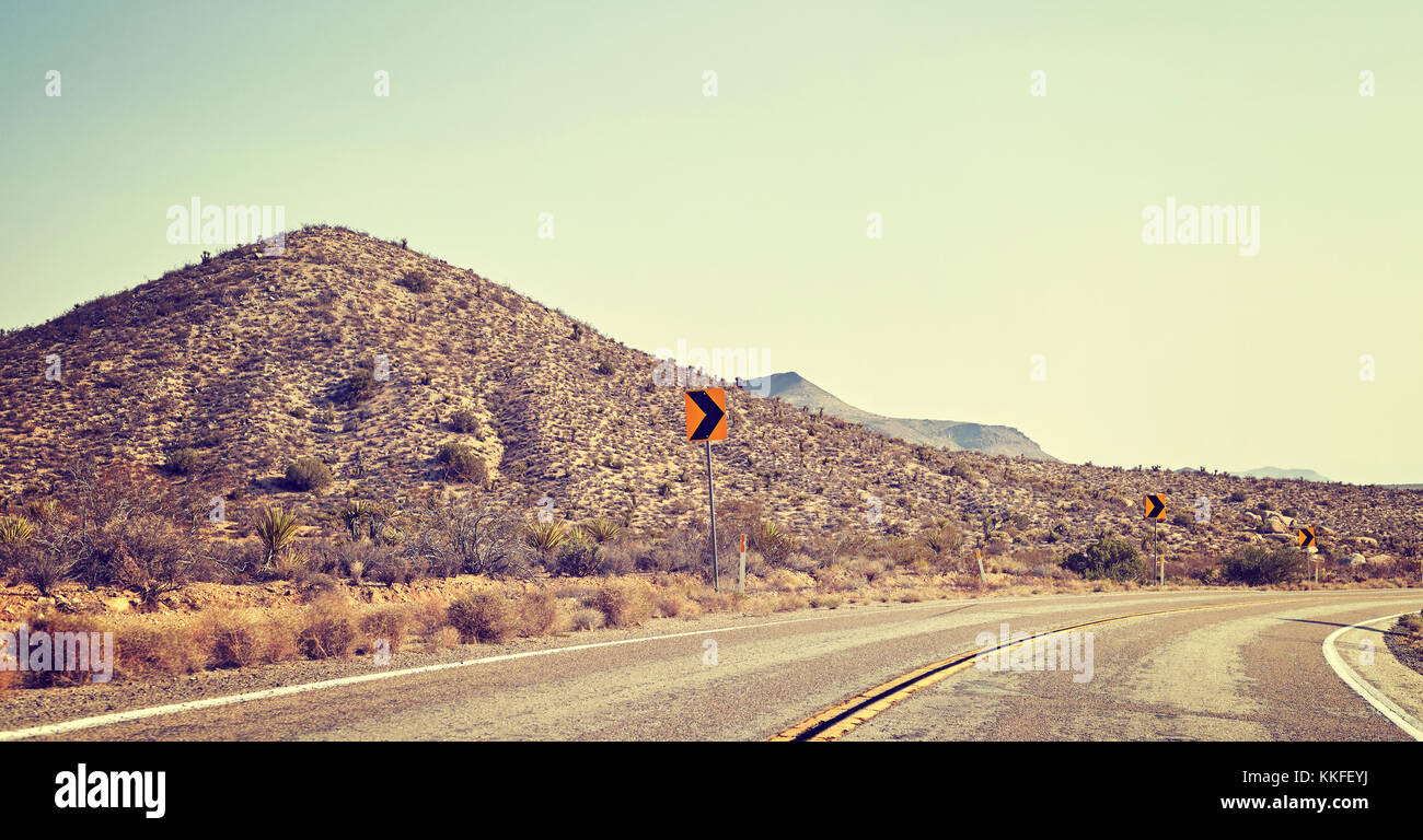 Desert road turn, color toned panoramic picture, travel concept, USA ...