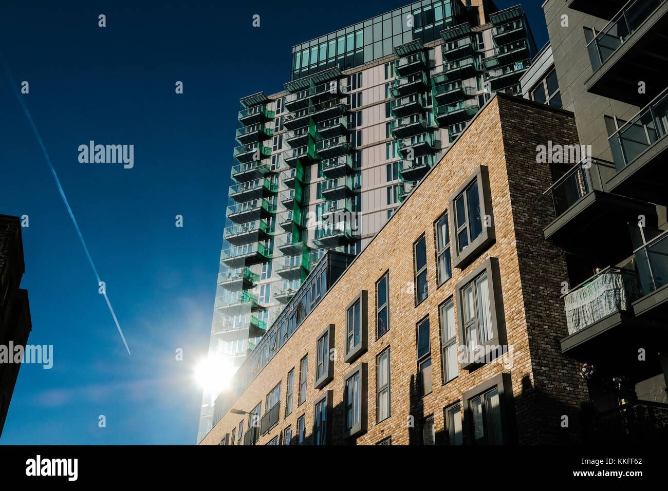 Low winter sun reflects off a glass window on a sunny winter afternoon ...