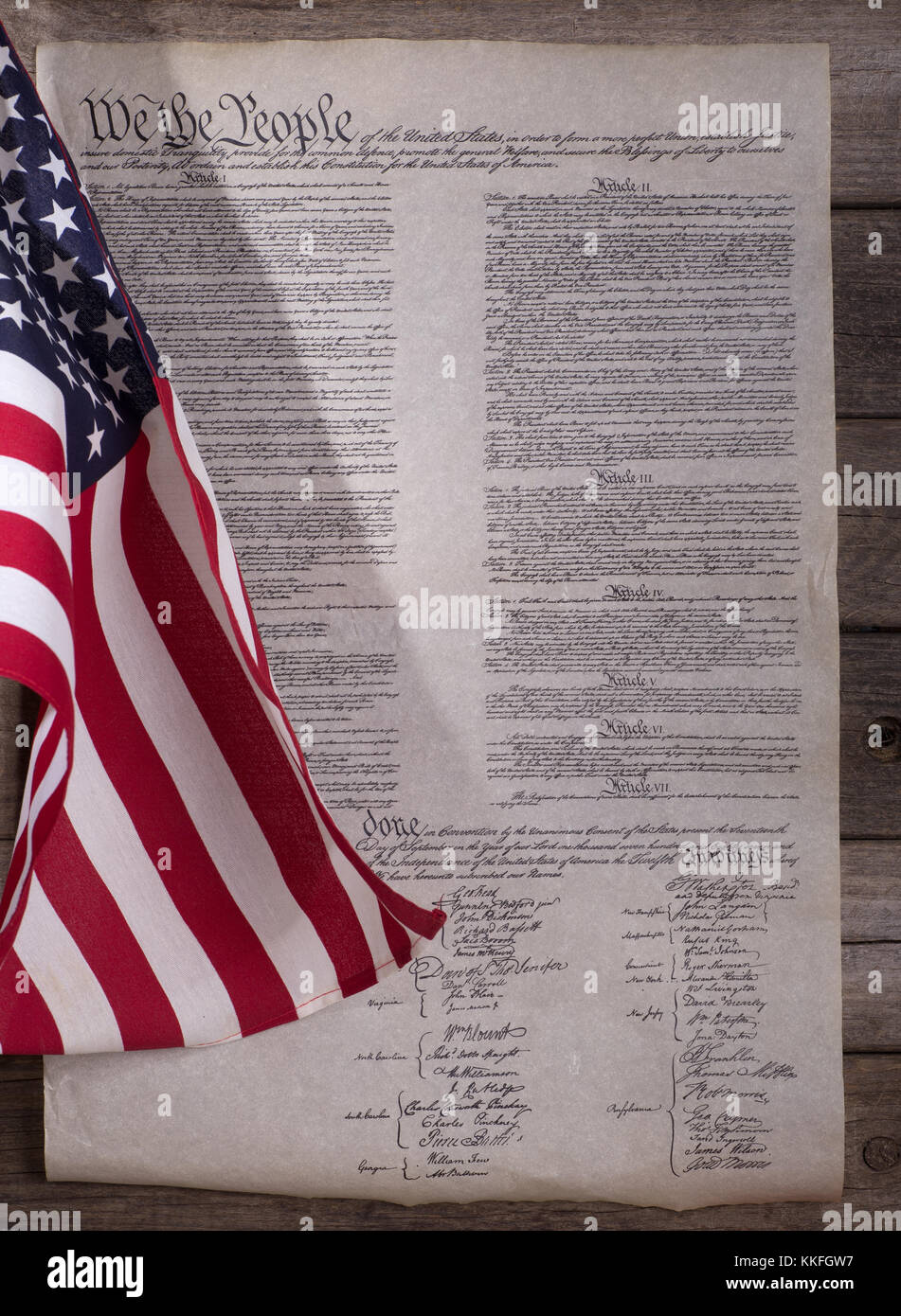 American flag and United States constitution on a wood background Stock ...