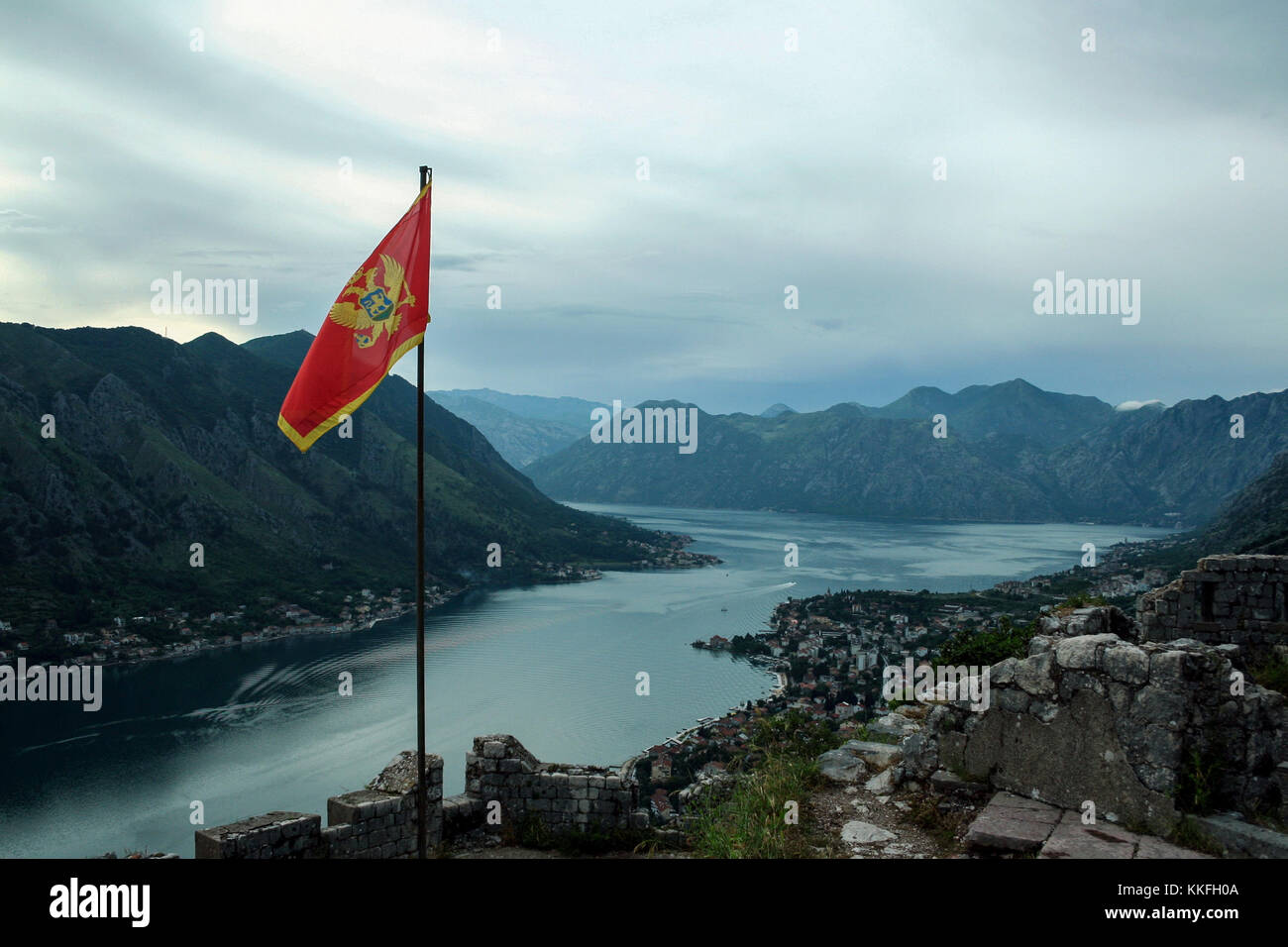 Flag of Montenegro taken in Kotor. The city and the Kotor bay can be ...