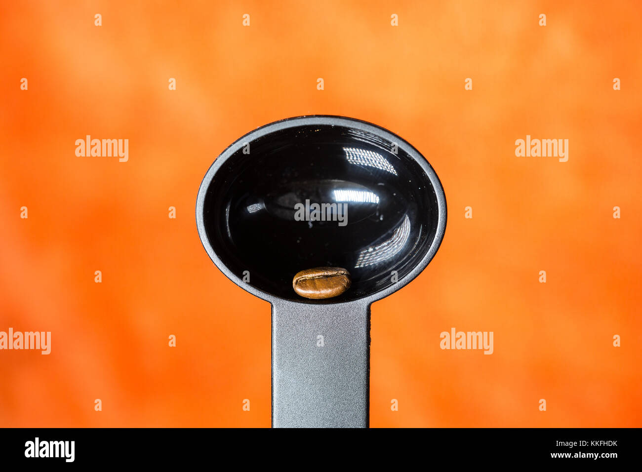 coffee bean in a plastic spoon Stock Photo - Alamy