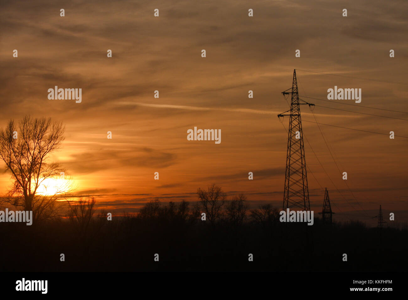 sunset landscape with electric tower Stock Photo - Alamy