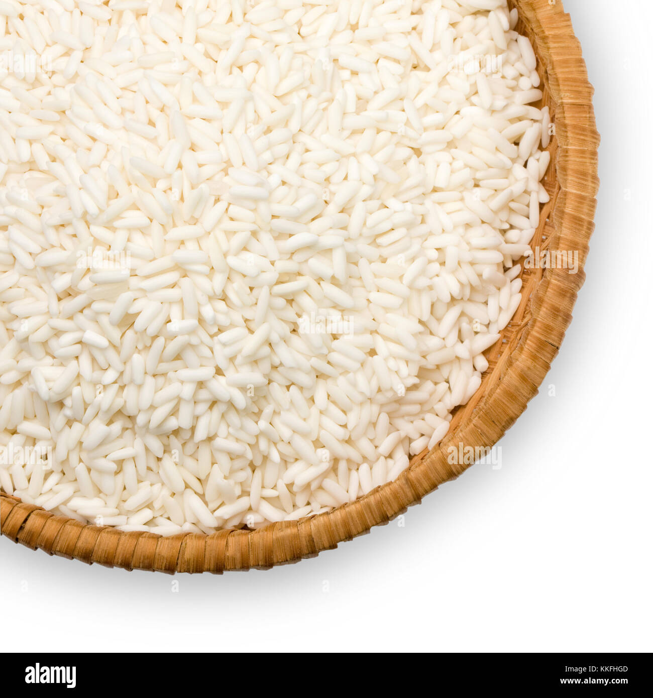 straw plate of white rice on a white background Stock Photo - Alamy