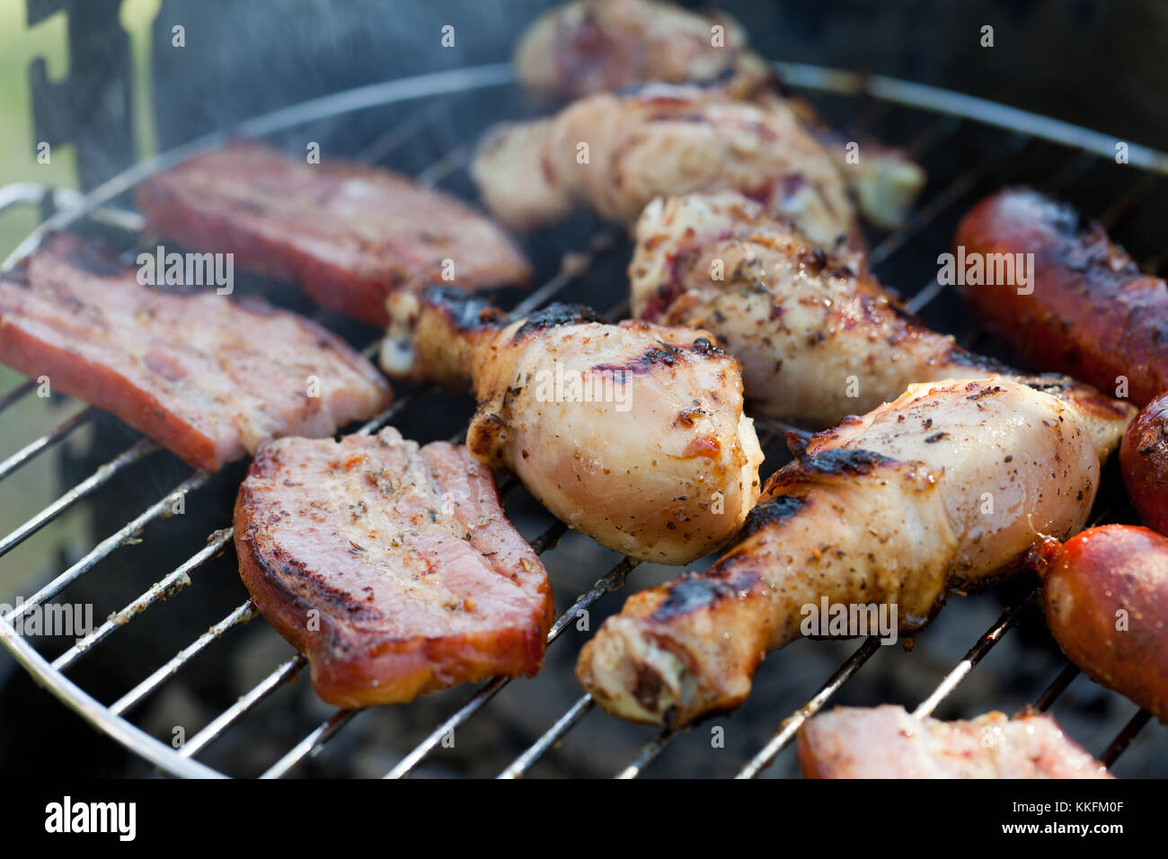 barbecue with delicious grilled meat on grill Stock Photo - Alamy