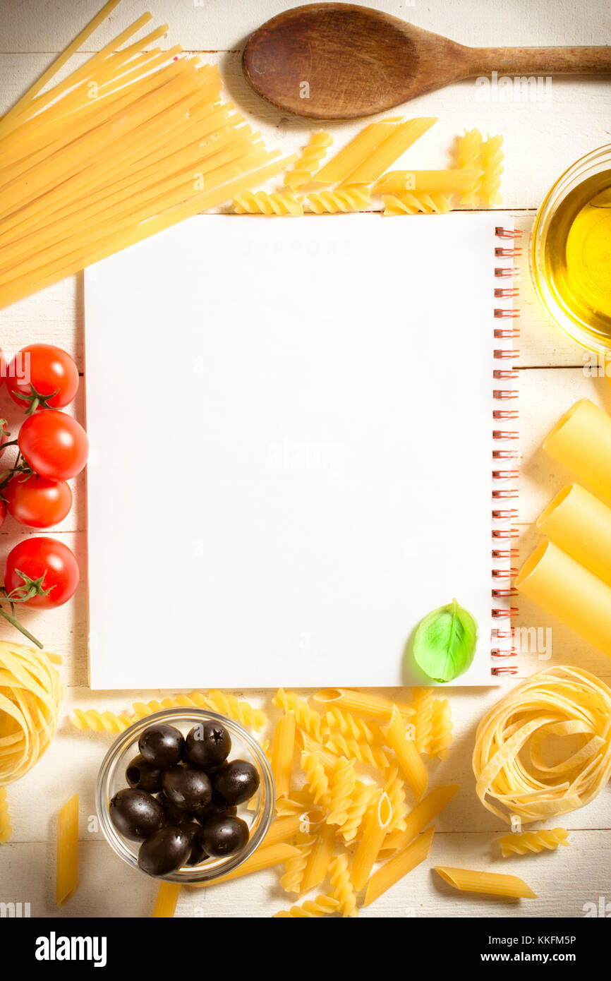 Blank cooking book with white background and ingredients all around ...