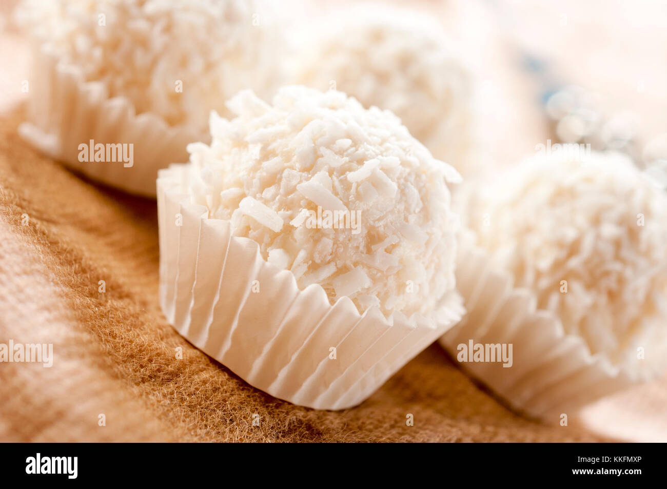 Fancy white pralines with coconut Stock Photo - Alamy