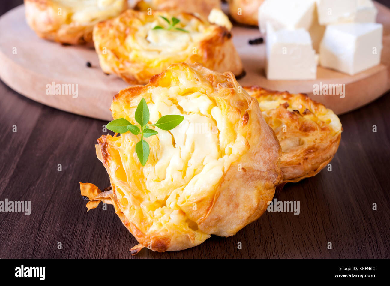 Fresh baked pastry with the melted feta cheese Stock Photo - Alamy