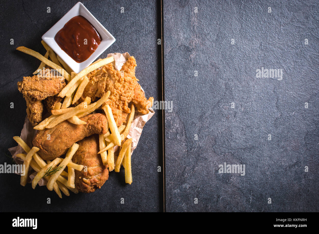 Fried chicken meat and French fries from above,blank space on the right ...