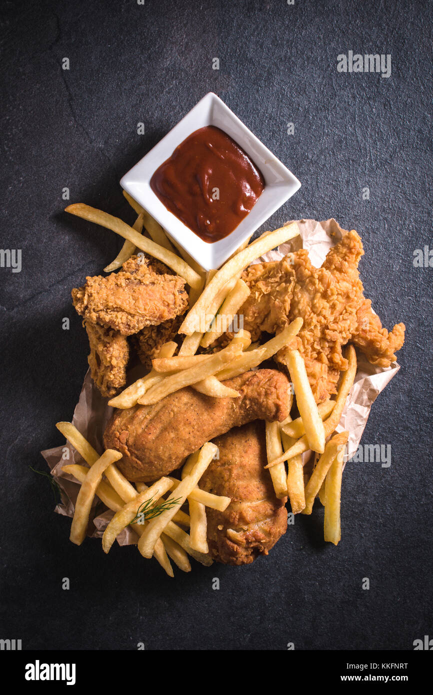 Fried chicken meat and French fries from above Stock Photo - Alamy