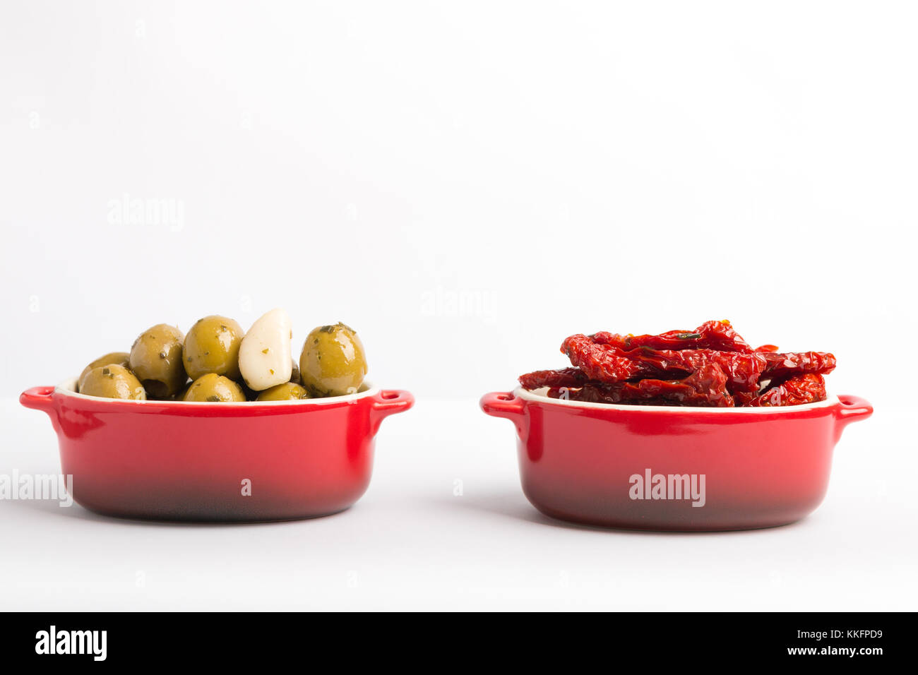 olives and dried tomato on a white background Stock Photo - Alamy