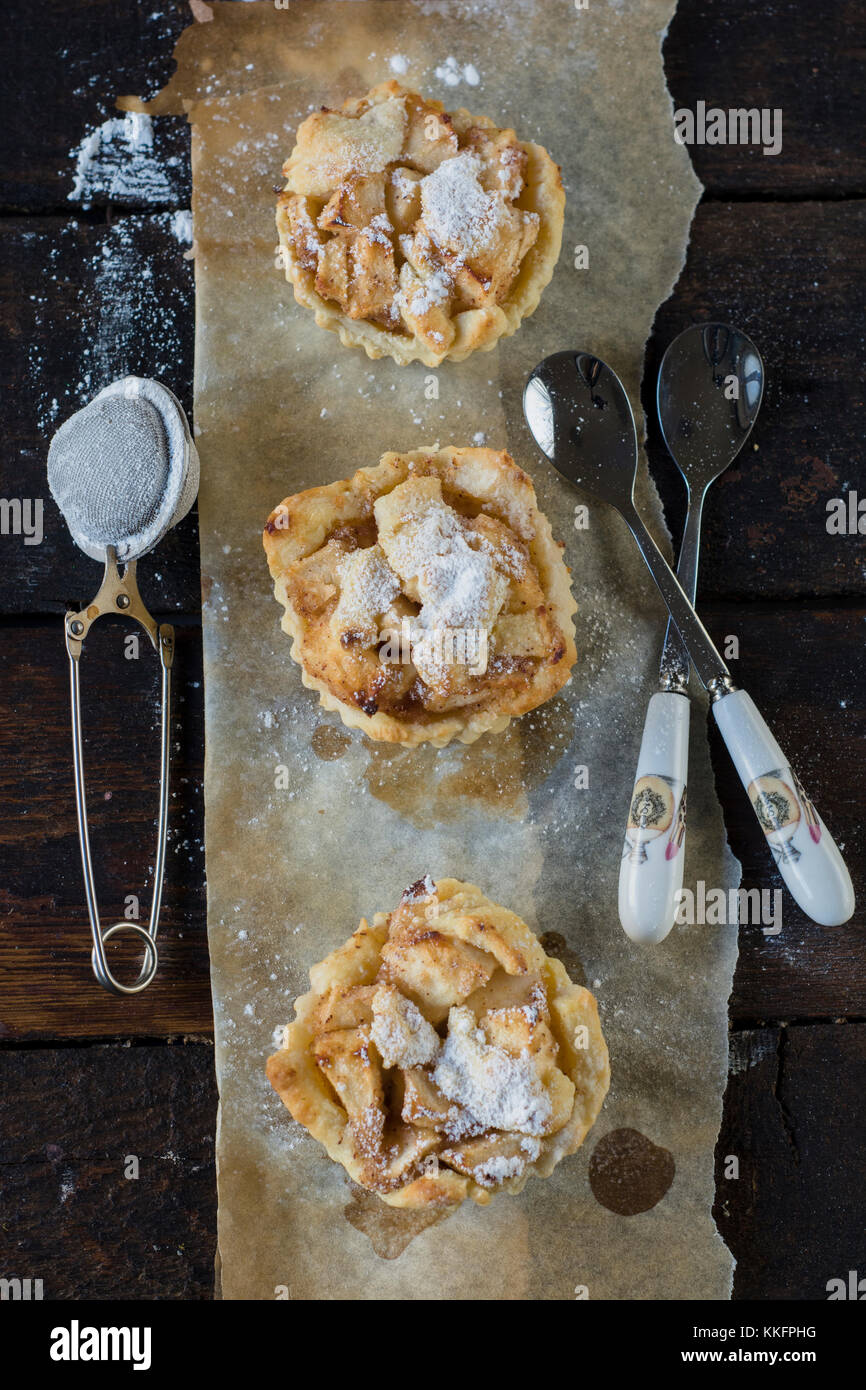 Mini apple pies from above on wooden background,selective focus Stock ...
