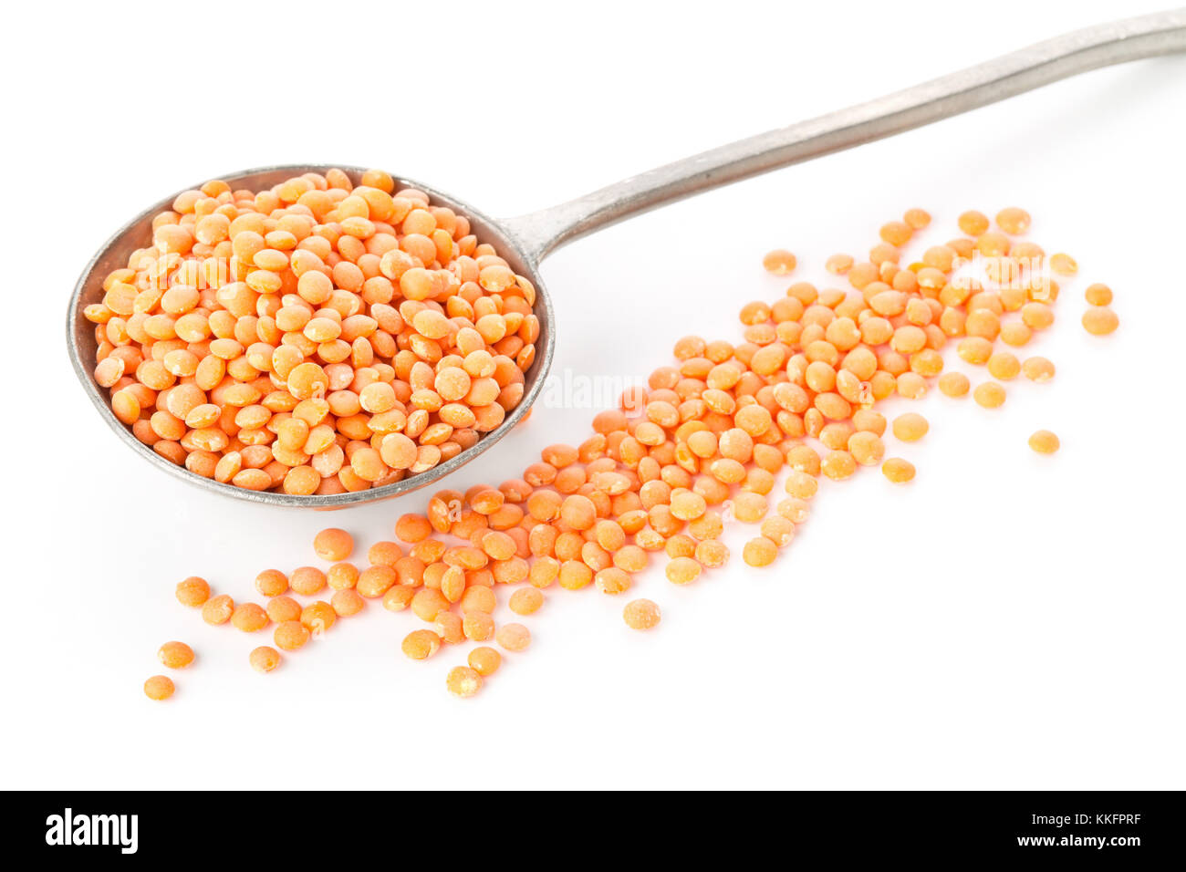Raw red, dried lentils in metal spoon over white background Stock Photo ...