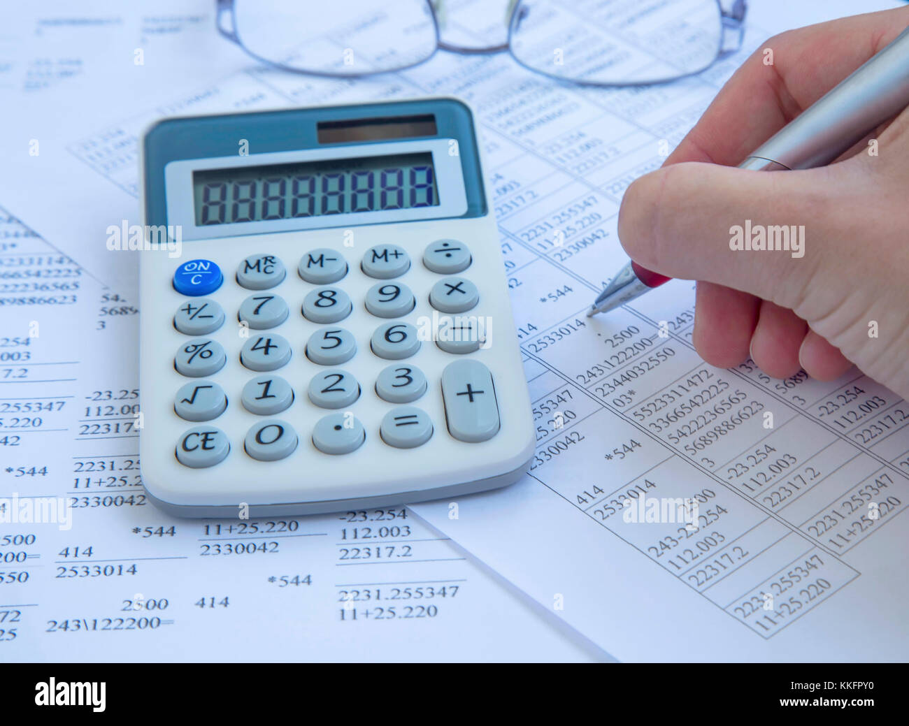 Accounting concept.Calculator with finance papers and man hand with pen ...