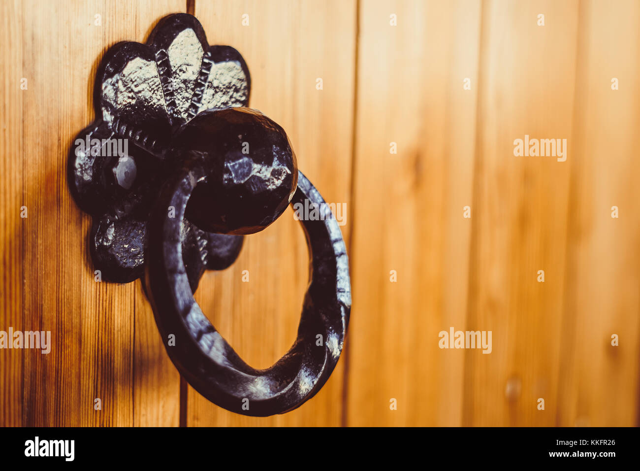 old metal handle on a wooden door Stock Photo - Alamy