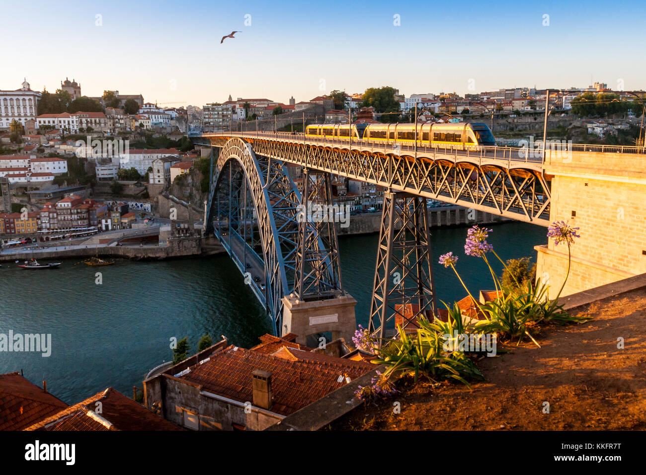 Dom Luis I Bridge in Porto at sunset with metro train Stock Photo - Alamy