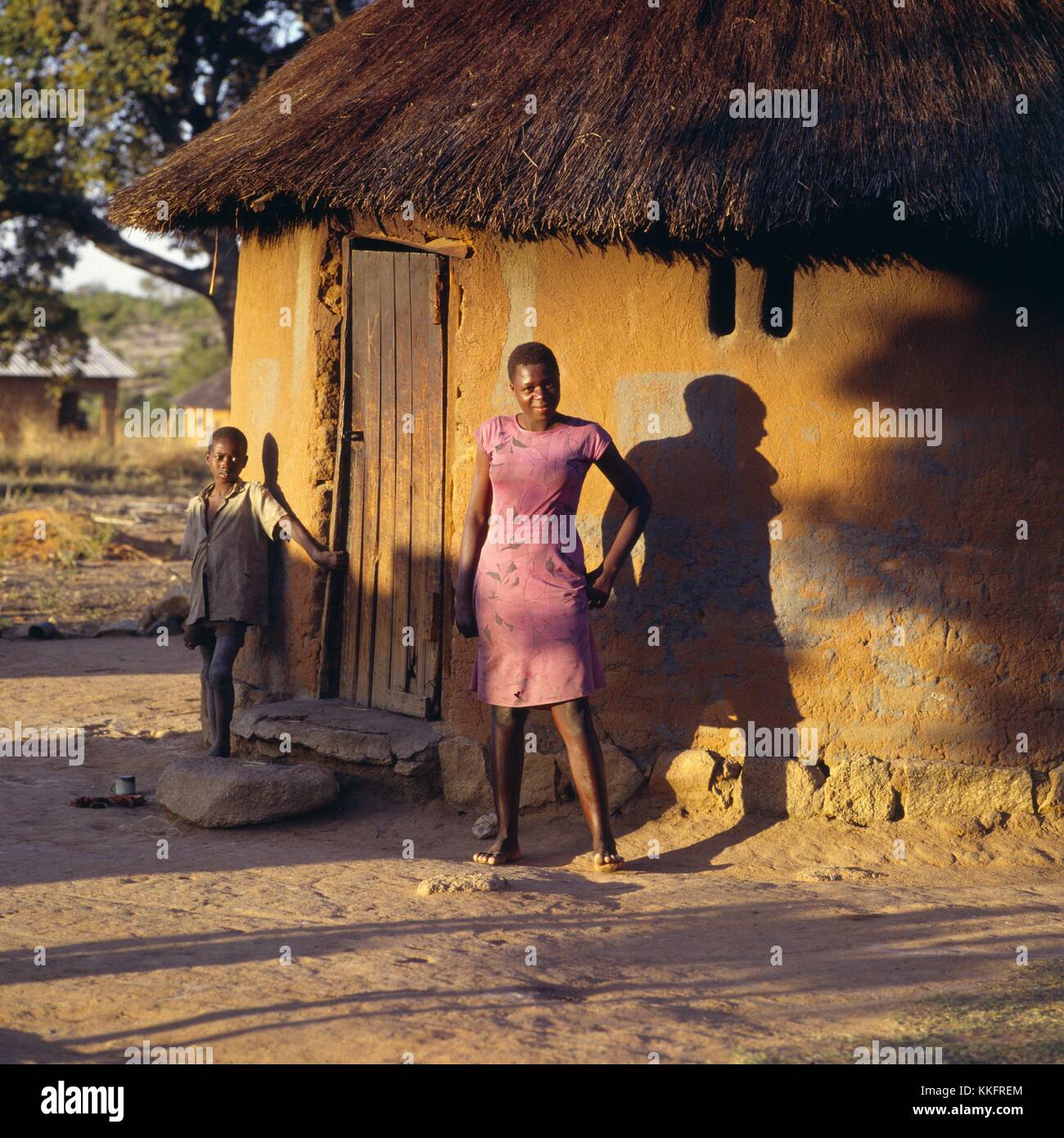 Young woman and boy, village near Gutu, Zimbabwe | usage worldwide ...