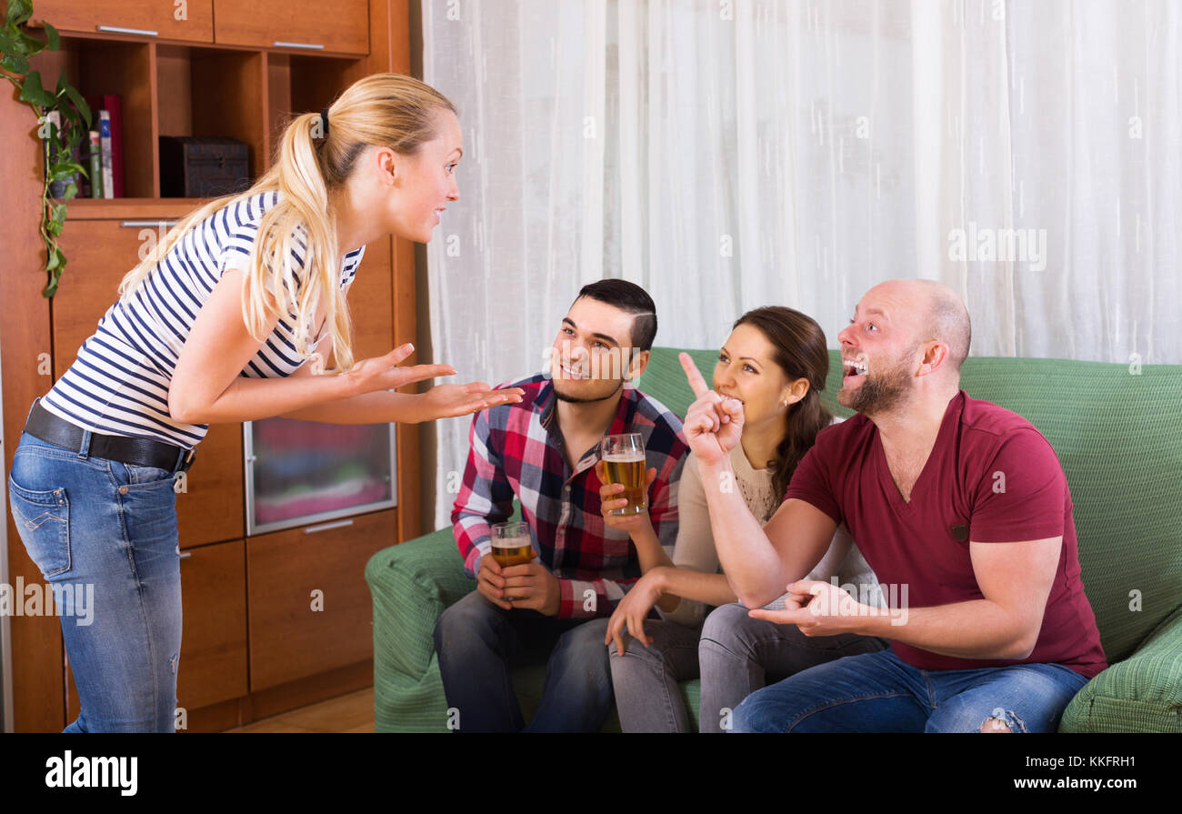 Group of smiling young adults having fun at house booze party Stock ...