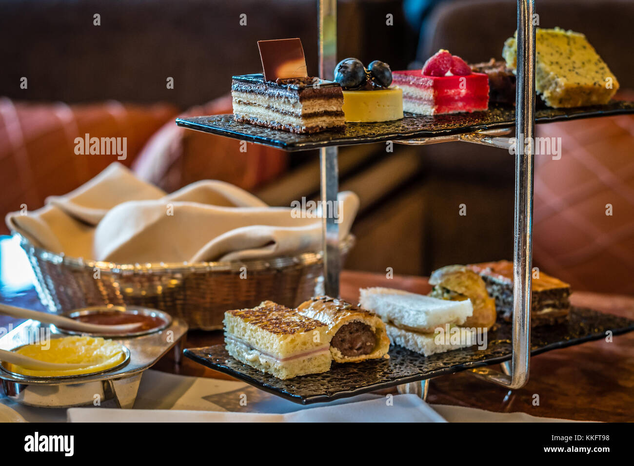 three tier afternoon tea set and pastries Stock Photo - Alamy