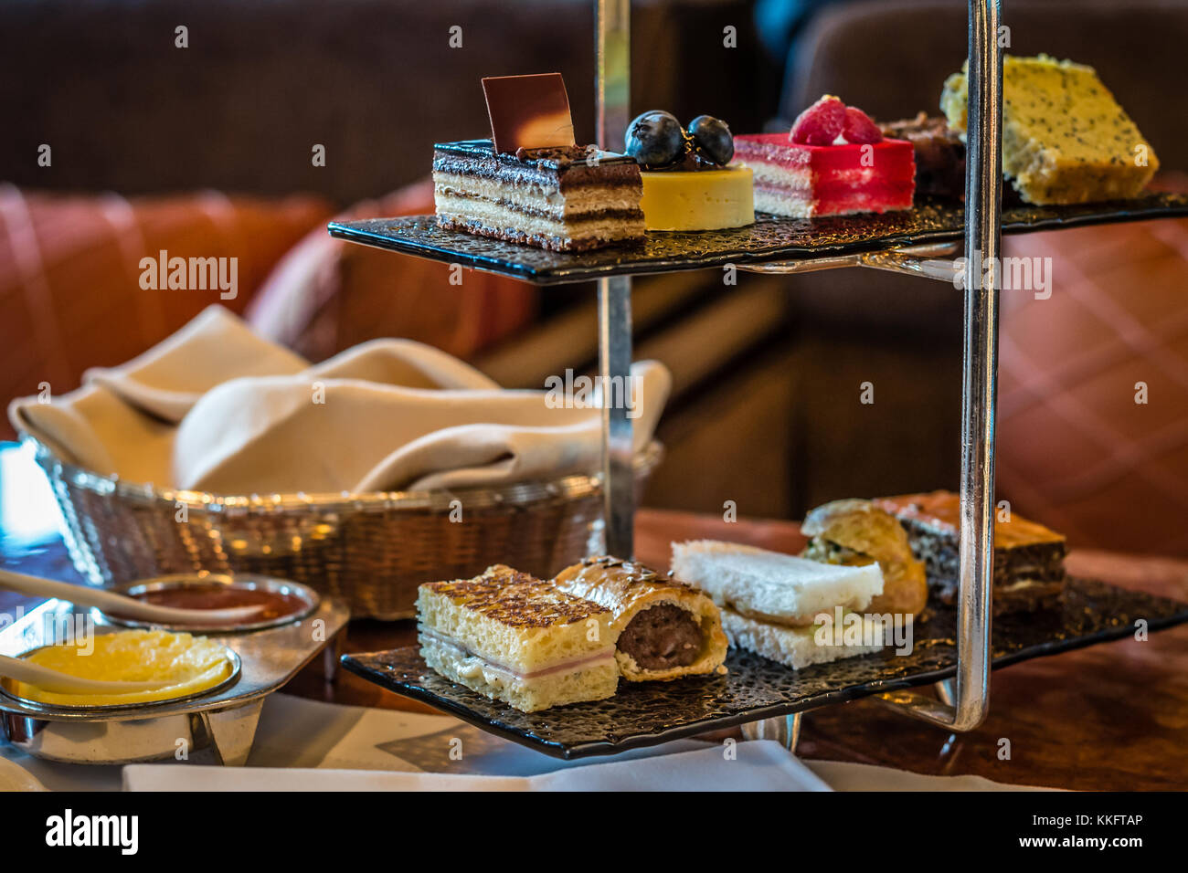 three tier afternoon tea set and pastries Stock Photo - Alamy