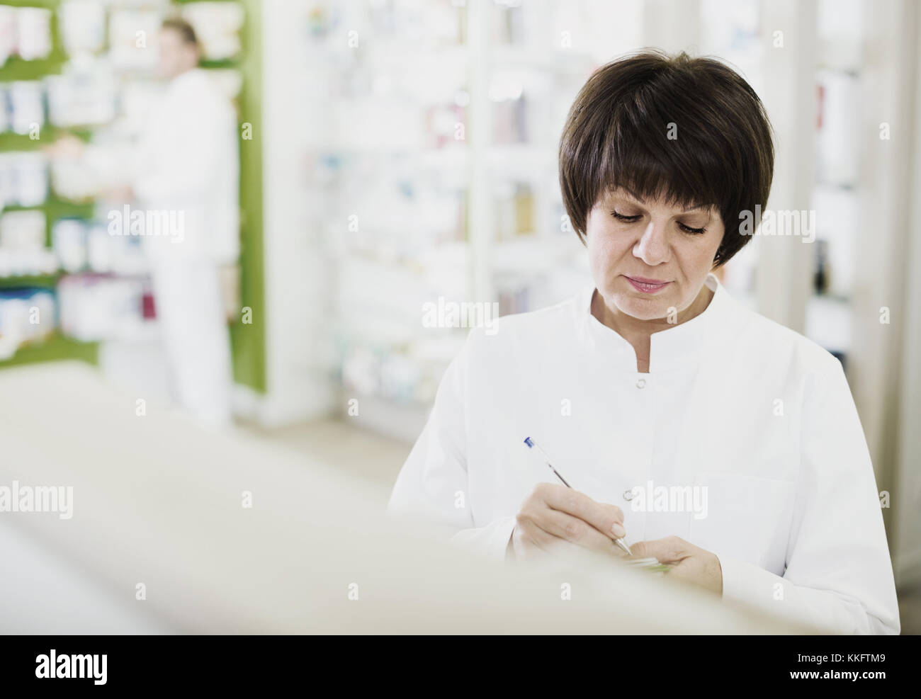 Woman pharmacist wearing uniform hi-res stock photography and images ...