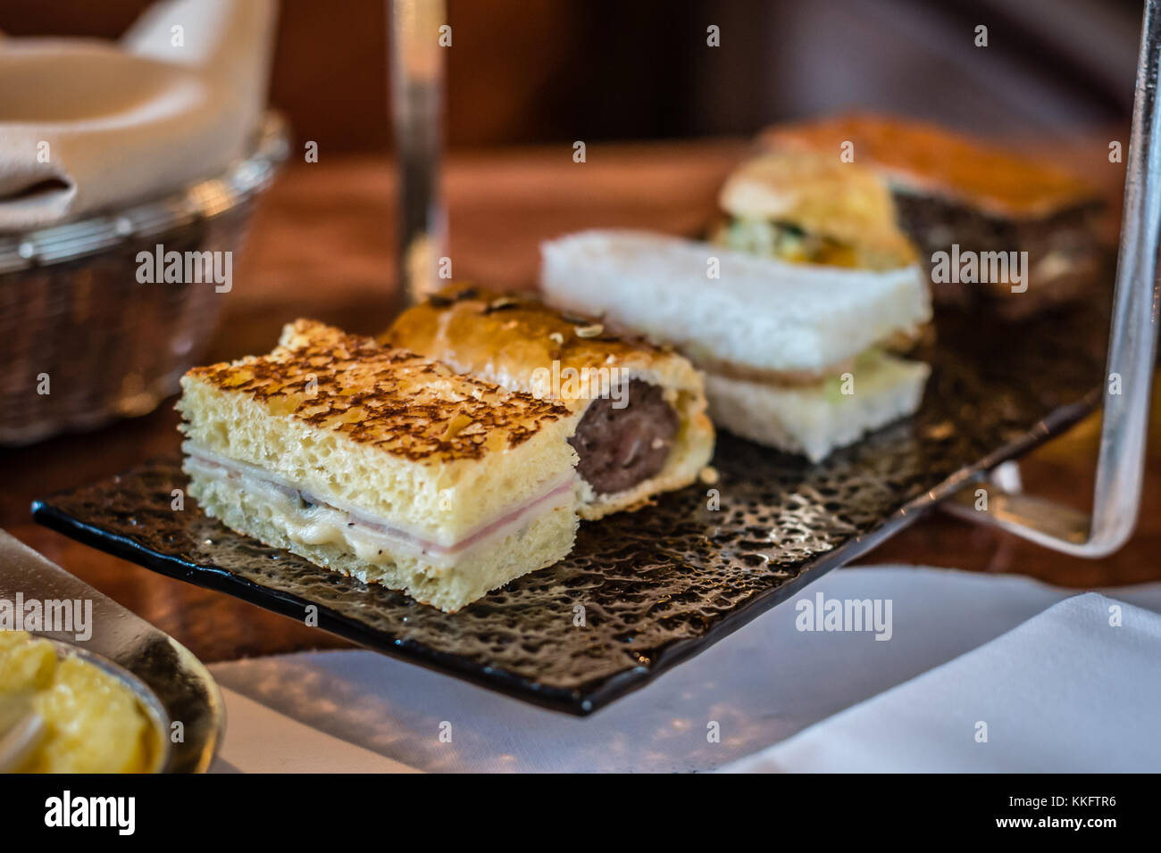 three tier afternoon tea set and pastries Stock Photo - Alamy