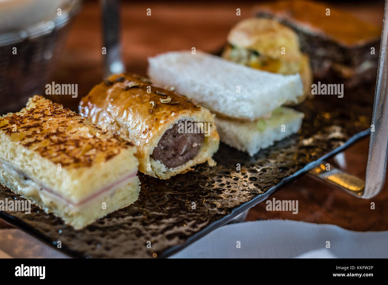 three tier afternoon tea set and pastries Stock Photo - Alamy
