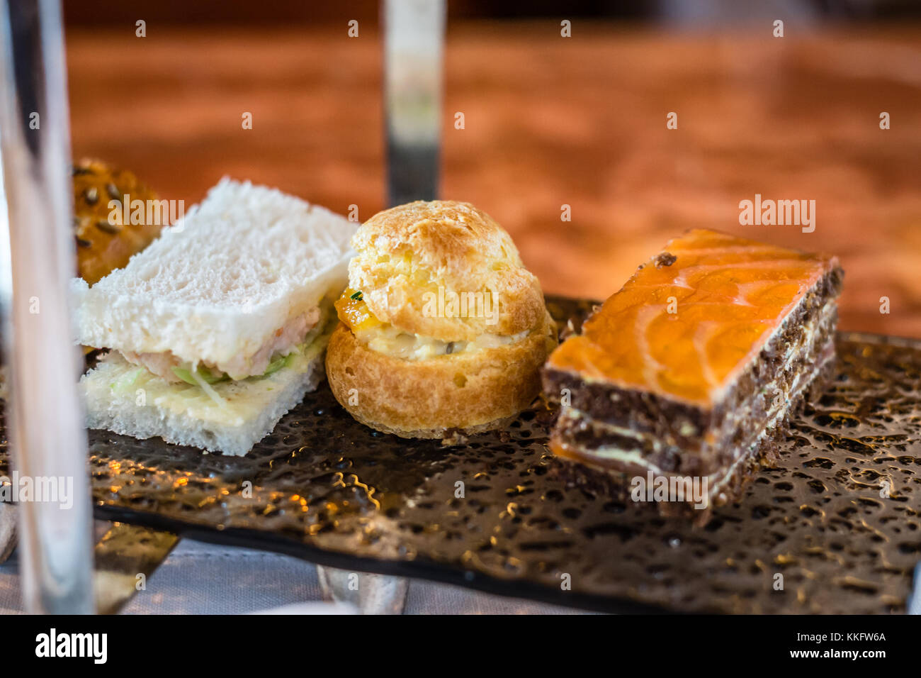 three tier afternoon tea set and pastries Stock Photo - Alamy