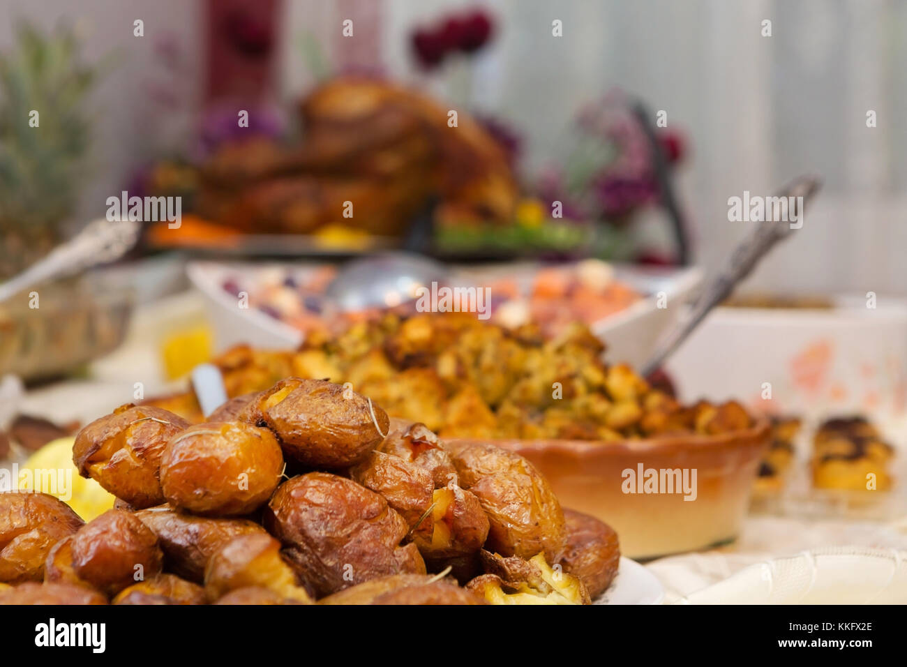 Bountiful Thanksgiving Table with Close Up of Roasted Baby Potatoes ...