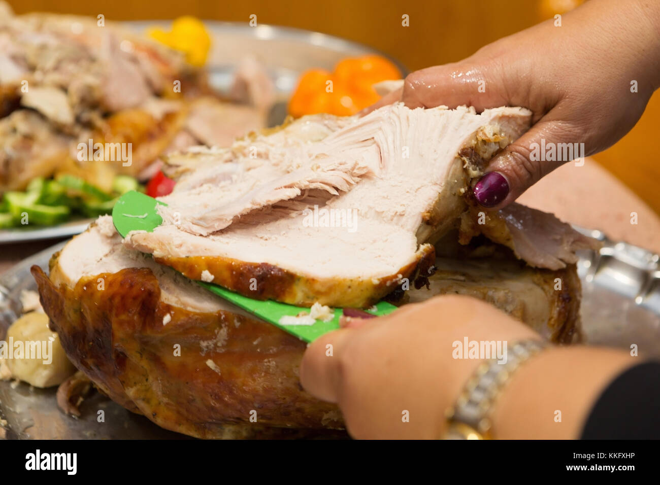 Close Up of Woman Cutting Turkey Slices Stock Photo - Alamy