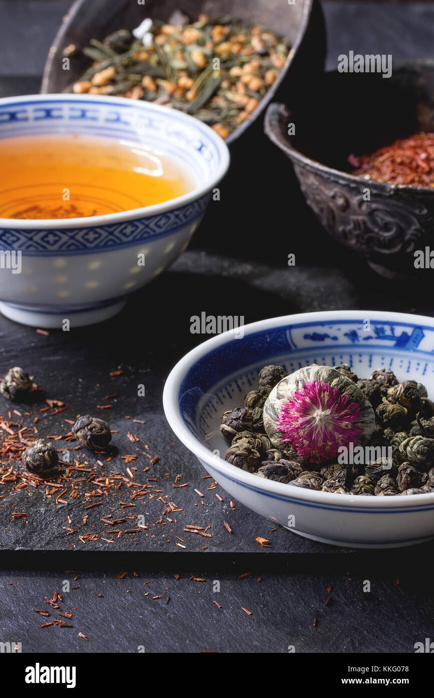 Assortment of dry tea and cup of hot tea. Green tea, black tae, green ...