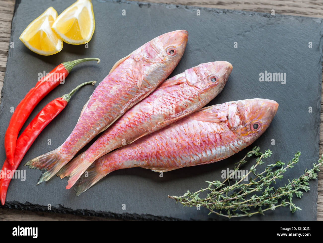 Raw red mullet with ingredients Stock Photo - Alamy