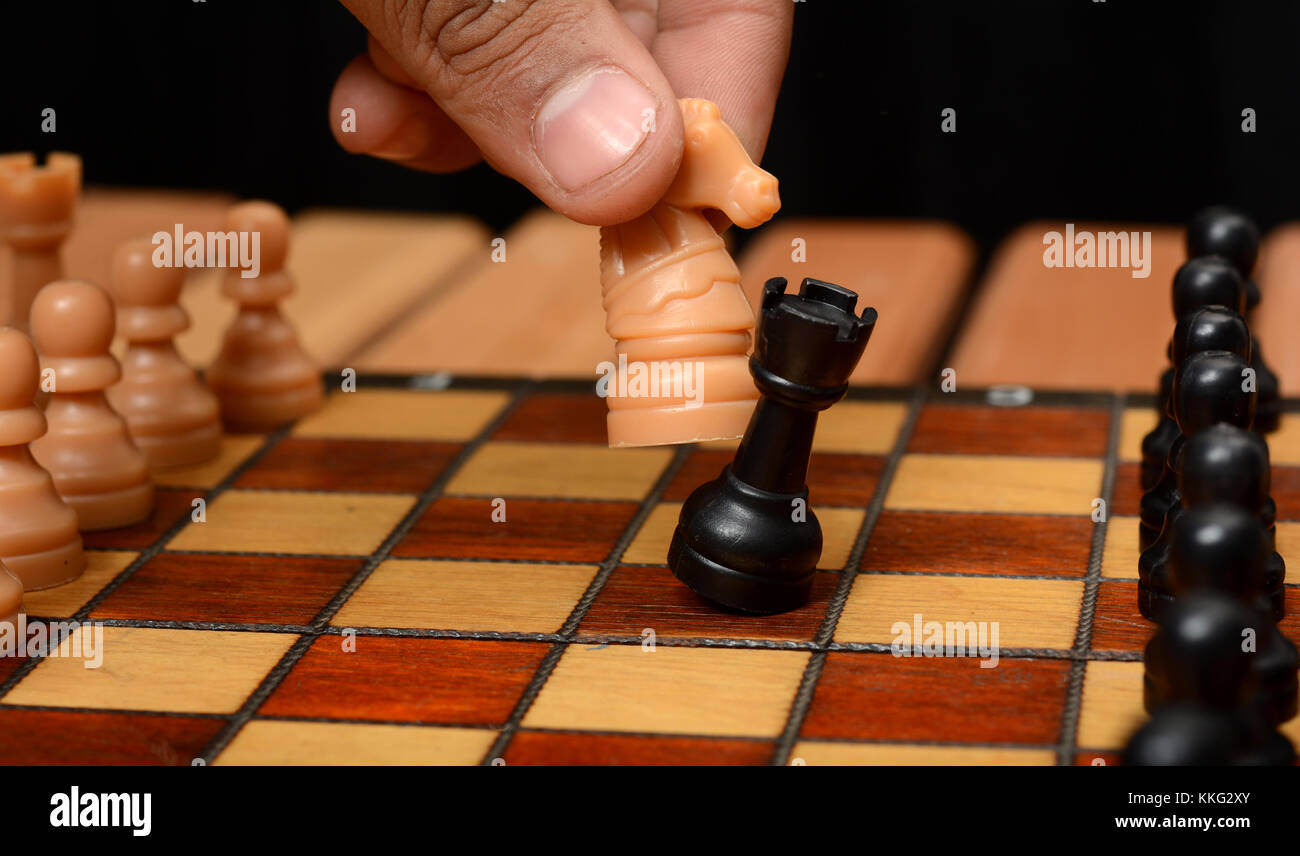 Checkmate playing concept with chessboard pawns and knight Stock Photo ...