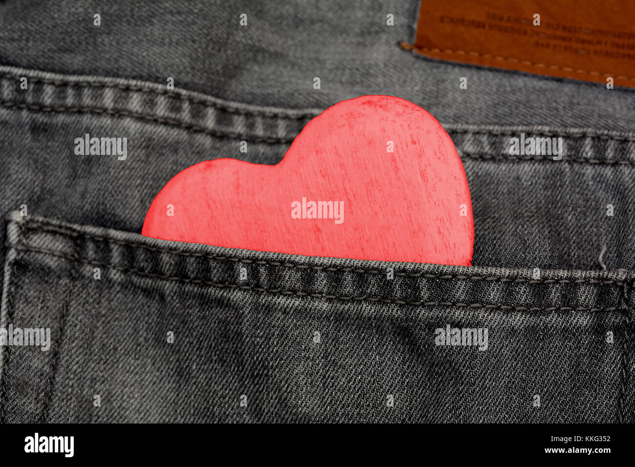 Red Color Heart in Jeans pocket Romantic concept Stock Photo - Alamy