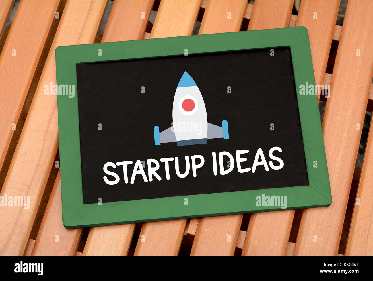 Startup Ideas with rocket icon on chalkboard design Stock Photo - Alamy
