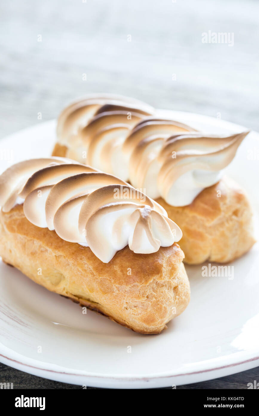 Eclairs with lemon curd and meringue Stock Photo - Alamy