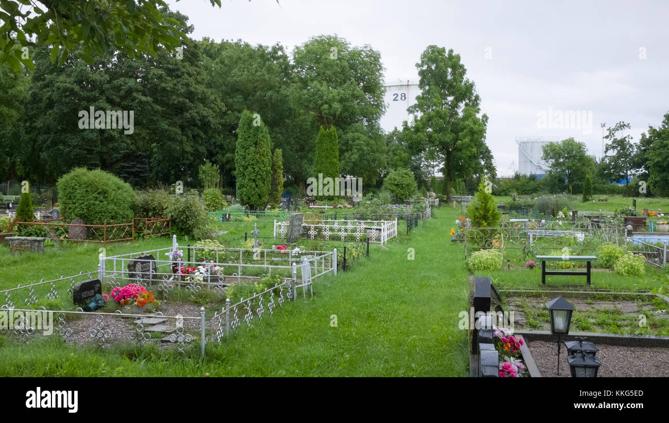 Graveyard near oil tanks, in the former closed town of Paldiski ...