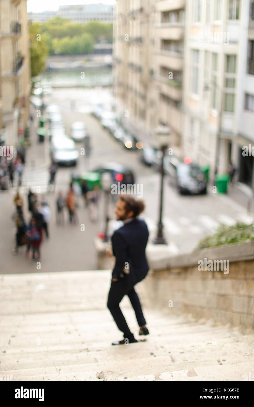 Handsome mix blood man walking down steps with newspaper Stock Photo ...