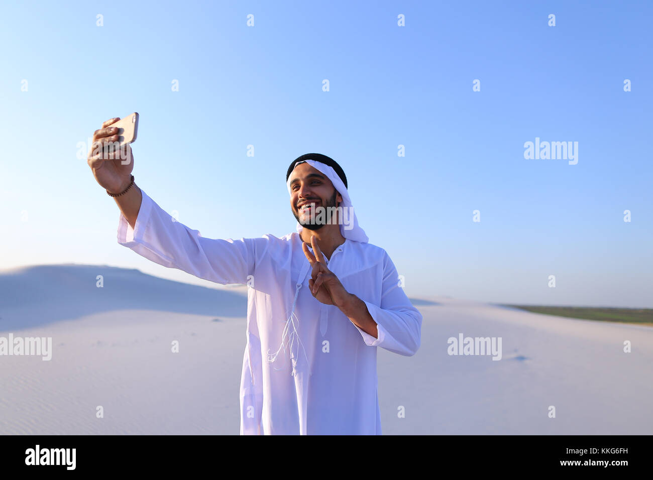 Portrait of Arabian sheikh man with gadget that communicates in Stock ...