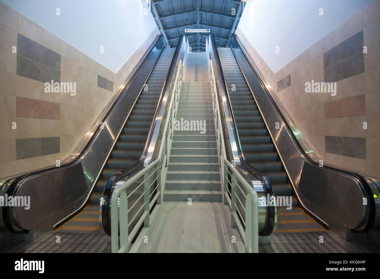 Escalators in movement in a train station, going from the underground ...