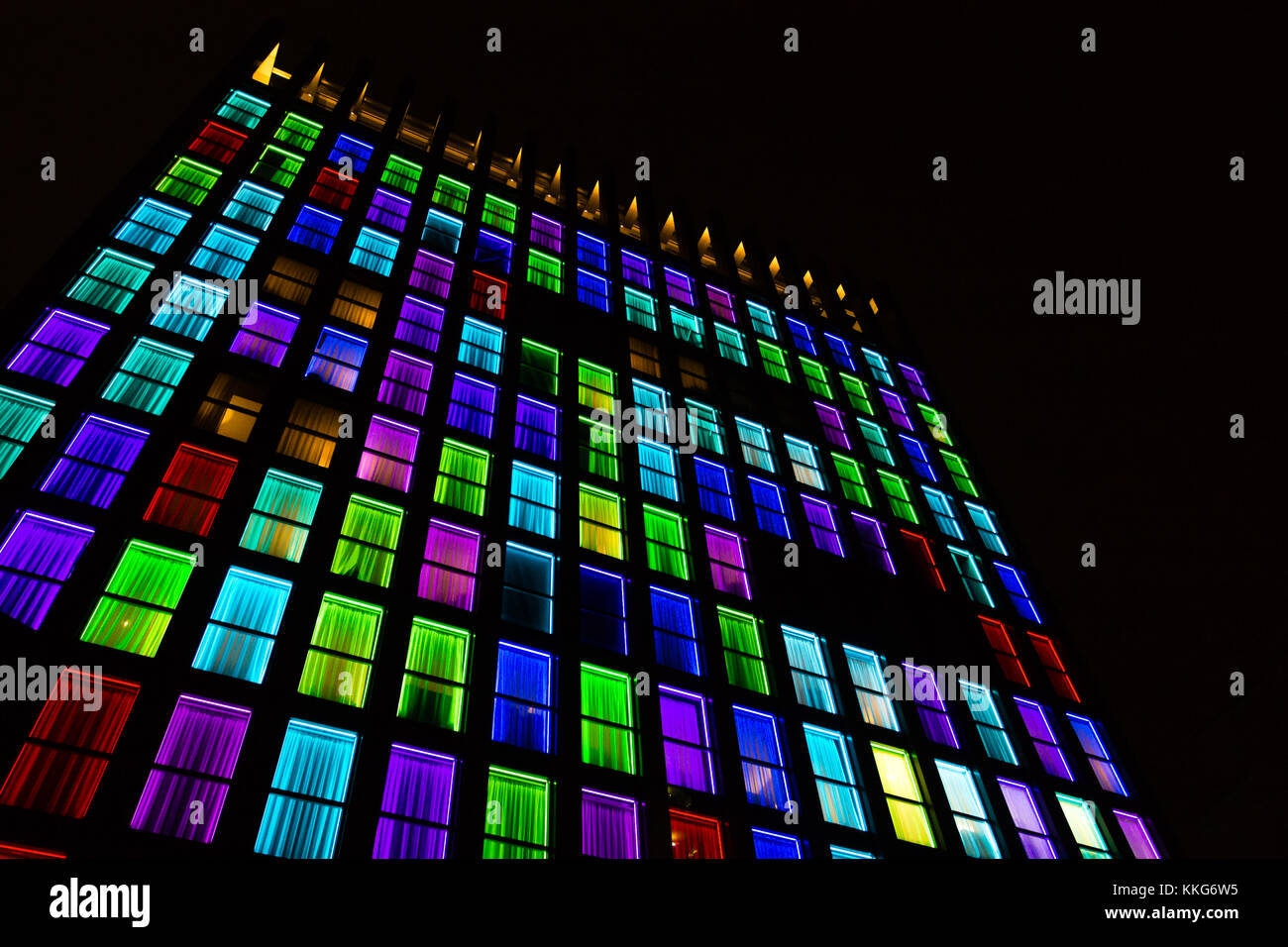 Colored windows texture. Windows illuminated by neon lights background ...