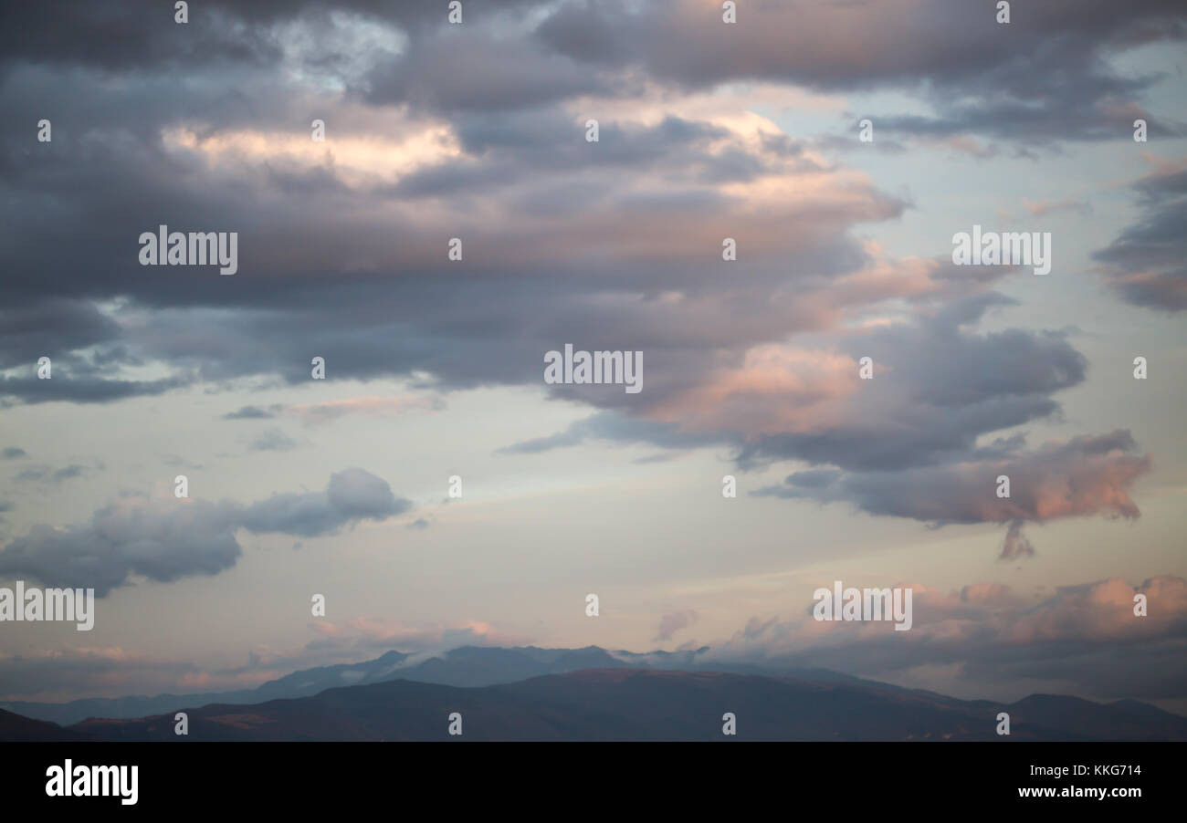 A landscape with magenta colored clouds Stock Photo - Alamy