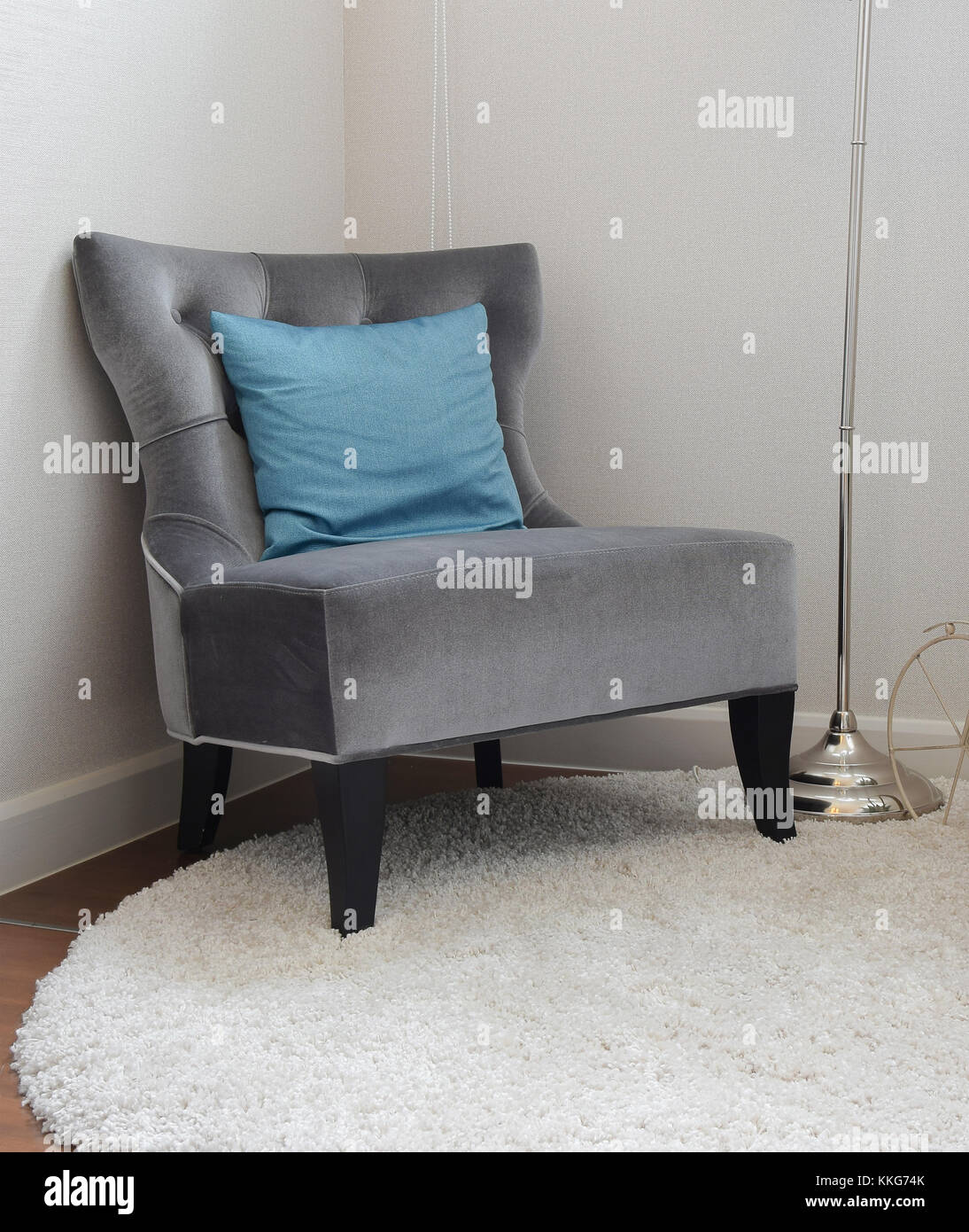 luxury grey tweed sofa with blue pillow in living room Stock Photo - Alamy