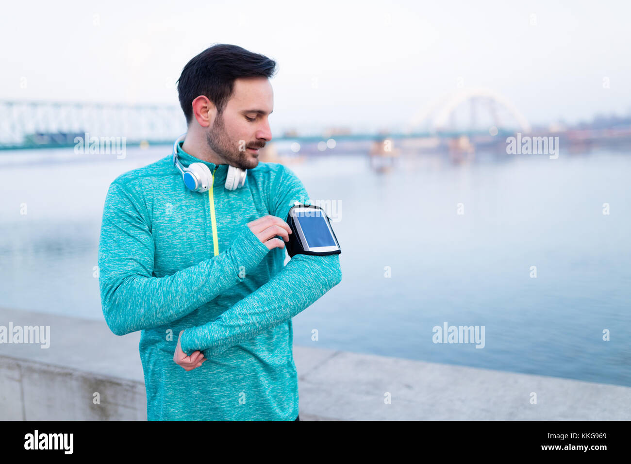 Young fitness man running in urban area Stock Photo - Alamy