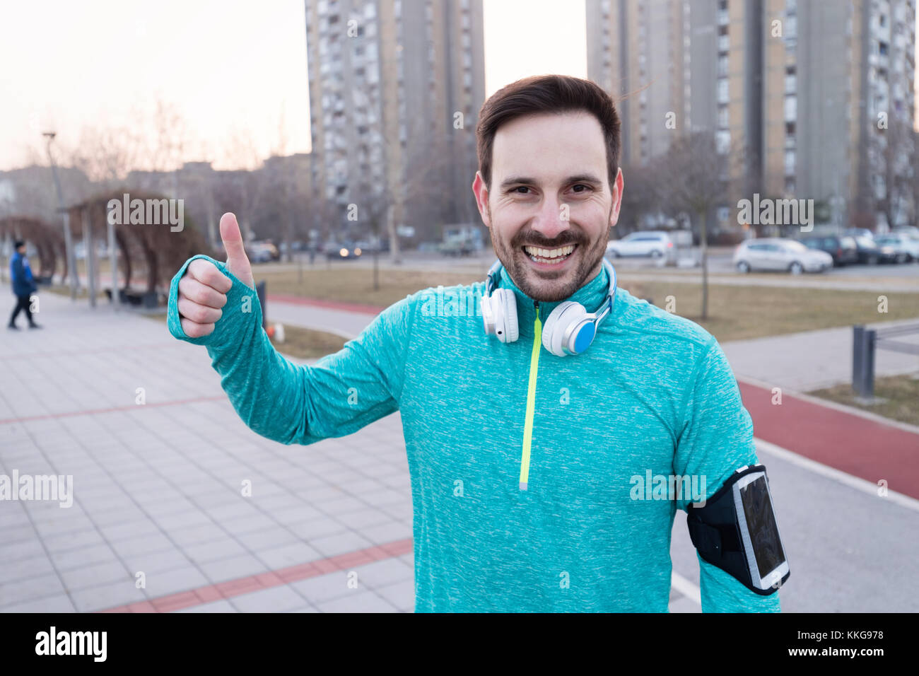 Young fitness man running in urban area Stock Photo - Alamy