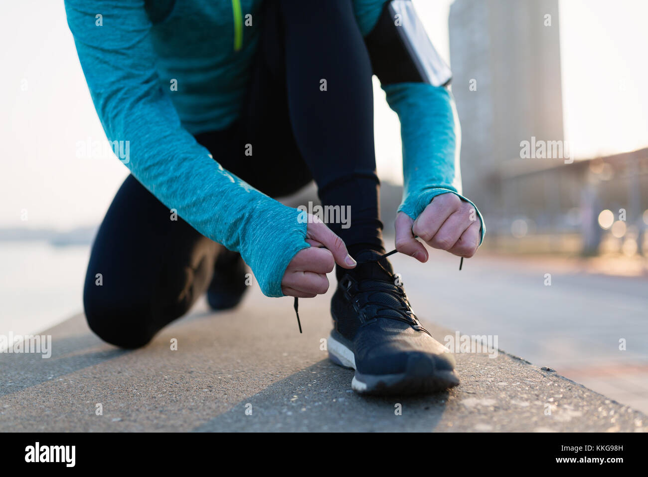 Runner trying running shoes getting ready for run Stock Photo - Alamy