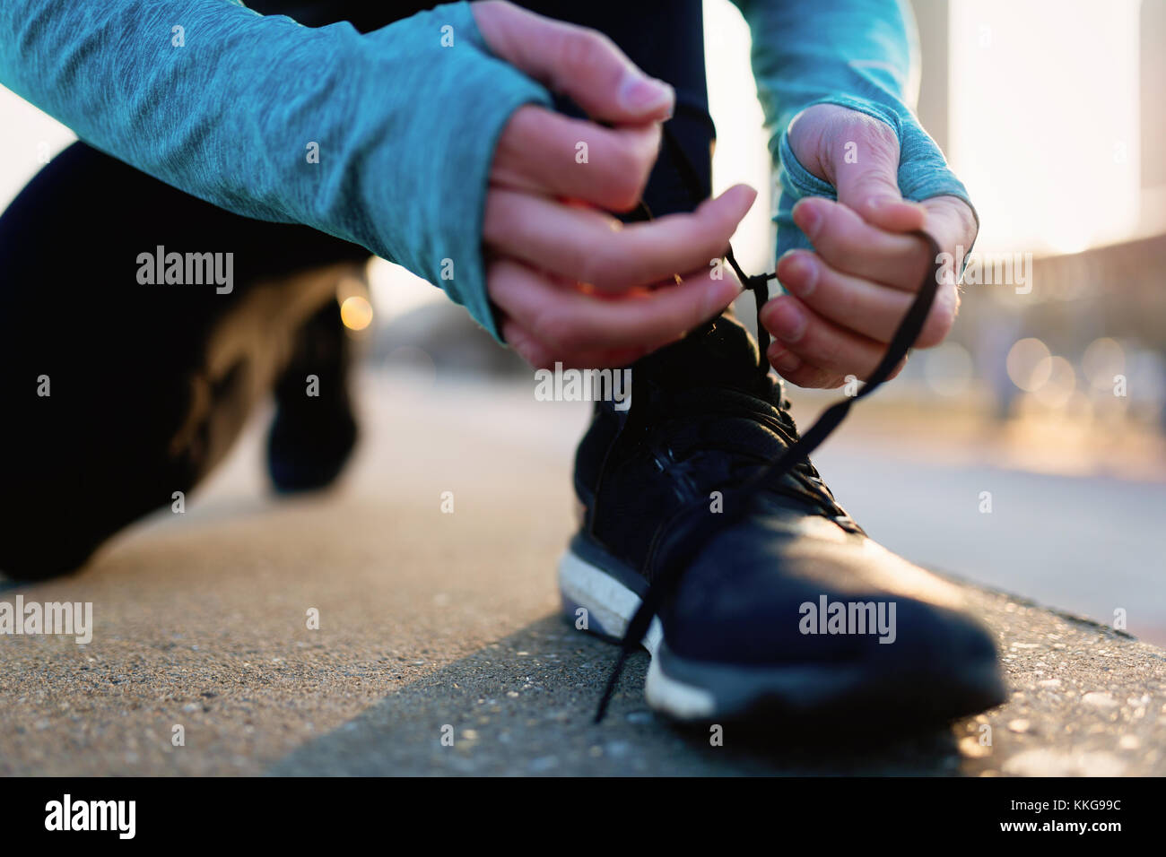 Runner trying running shoes getting ready for run Stock Photo - Alamy