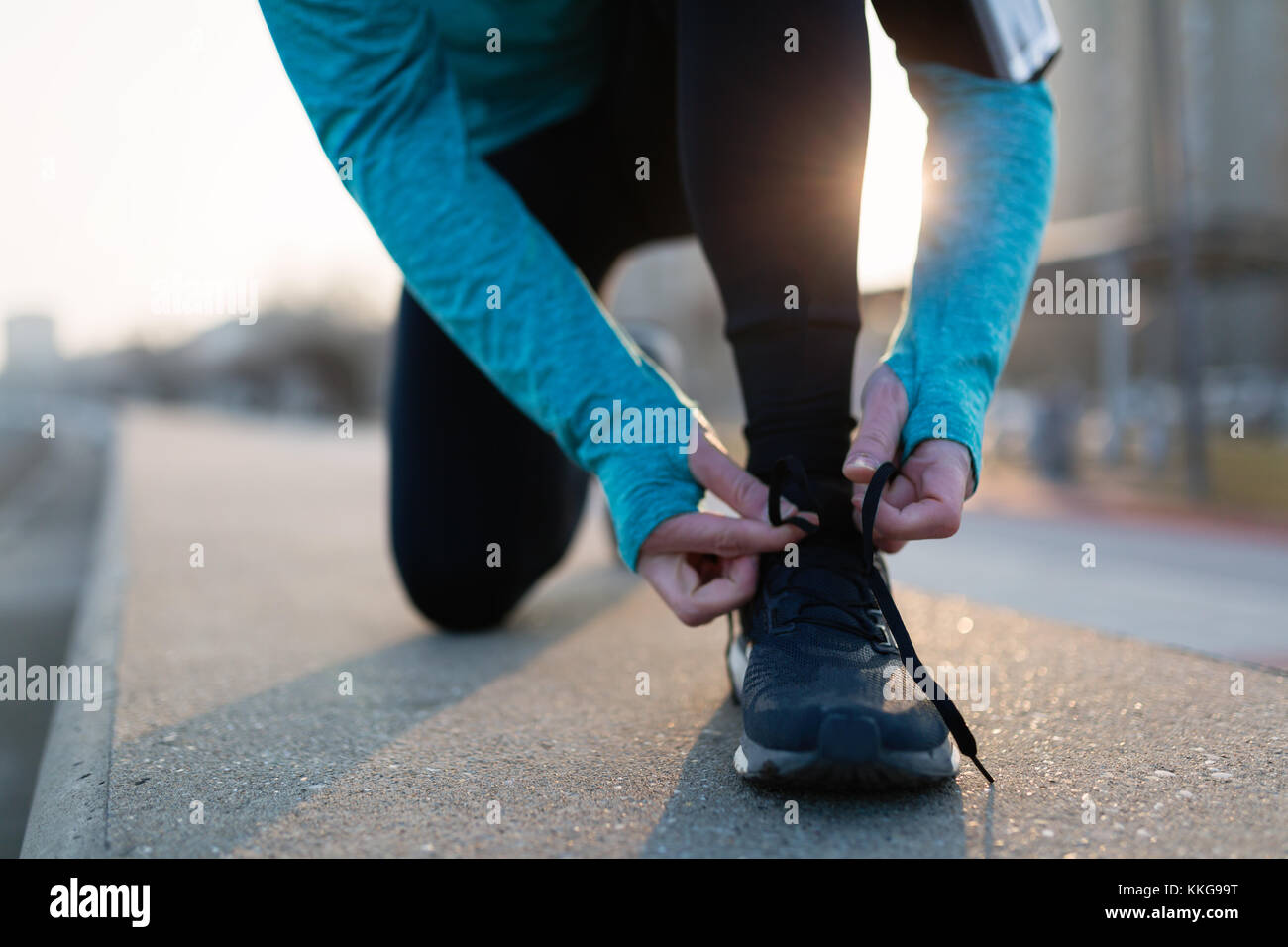 Runner trying running shoes getting ready for run Stock Photo - Alamy