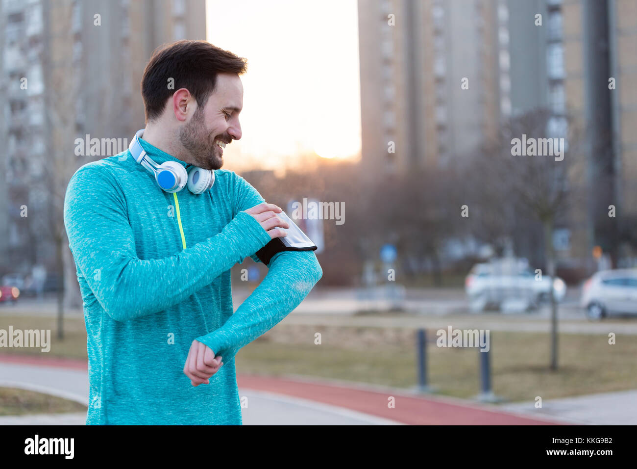 Young fitness man running in urban area Stock Photo - Alamy