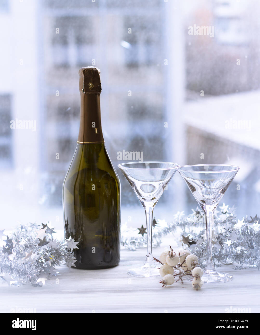 Two empty glasses and a bottle Stock Photo - Alamy