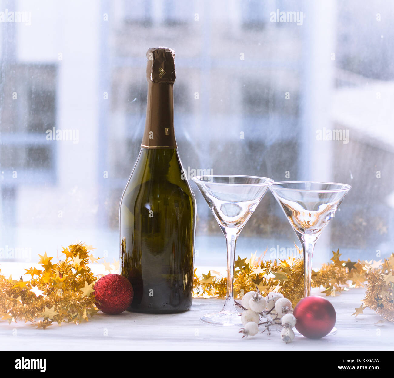 Two filled glasses and a bottle Stock Photo - Alamy